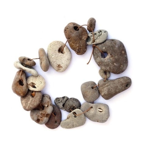 What Is A Hag Stone? Why Did Merlin the Magician Wear Them?